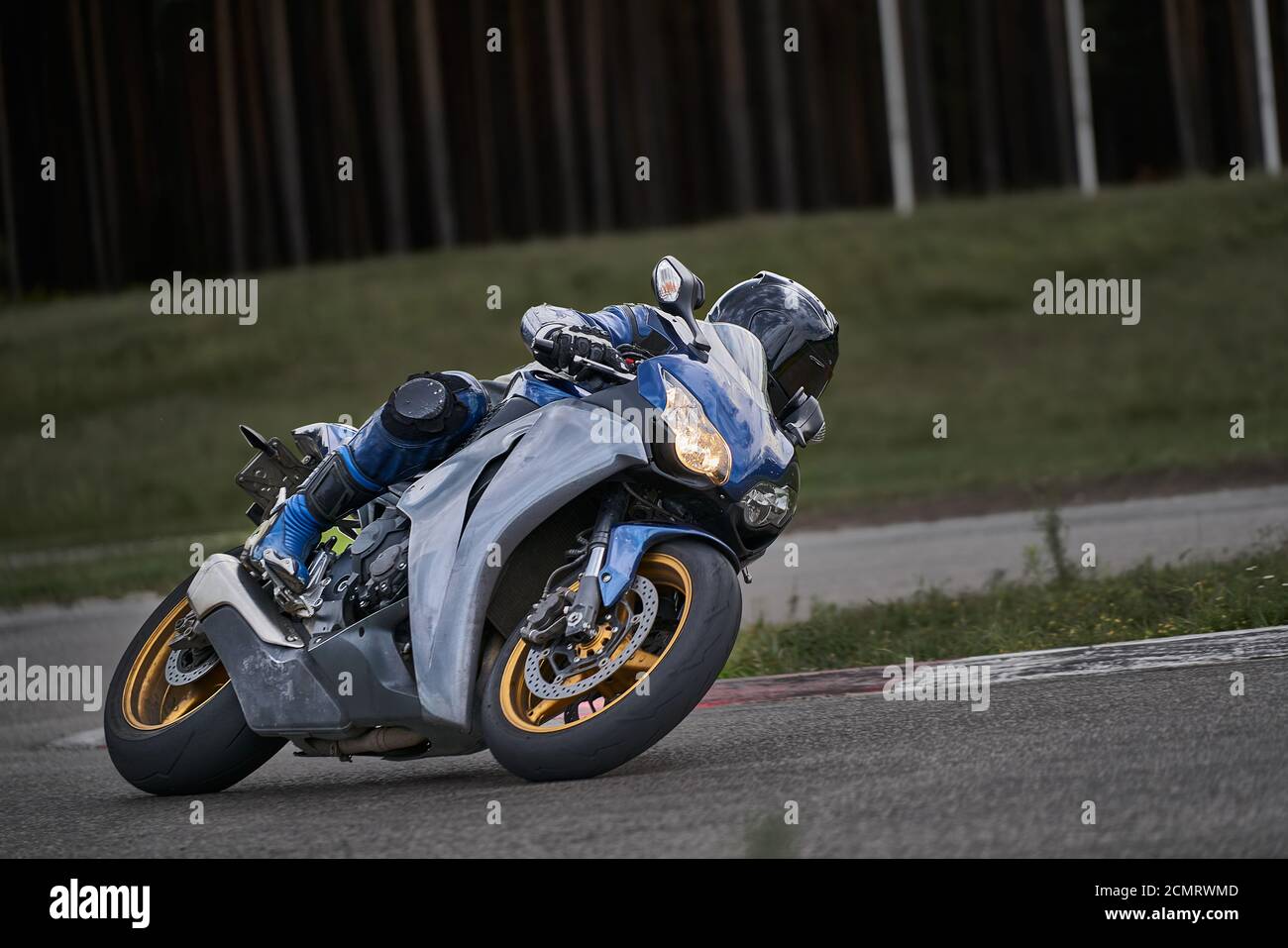 Handsome motorcyclist in black riding his super sport motorcycle Stock ...