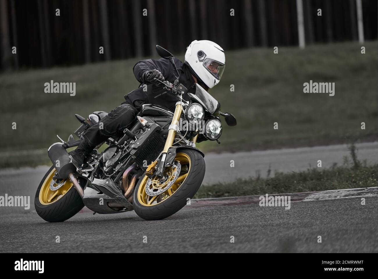 Handsome motorcyclist in black riding his super sport motorcycle Stock ...