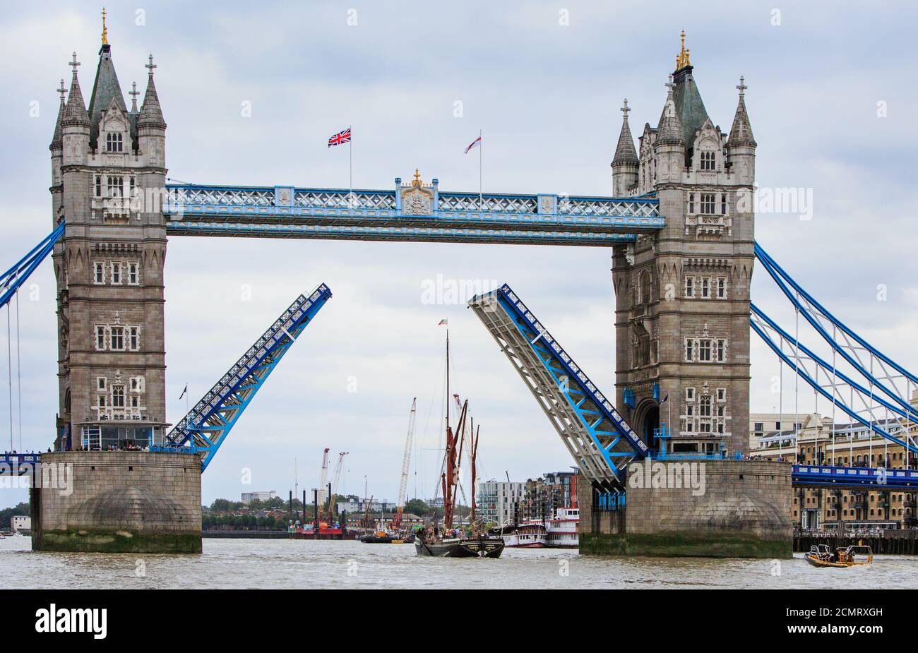 Tower Bridge on the River Thames , Opens to allow a tall ship to pass ...