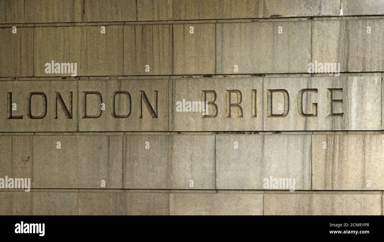 London Bridge wording as seen from under the bridge while on a city ...
