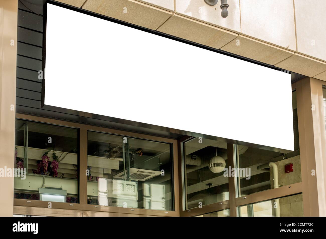horizontal black empty signage on clothes shop front with glass windows ...