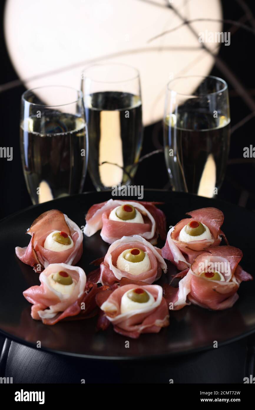 Original Halloween snacks. Eyeballs cooked from jamon with mozzarella ...