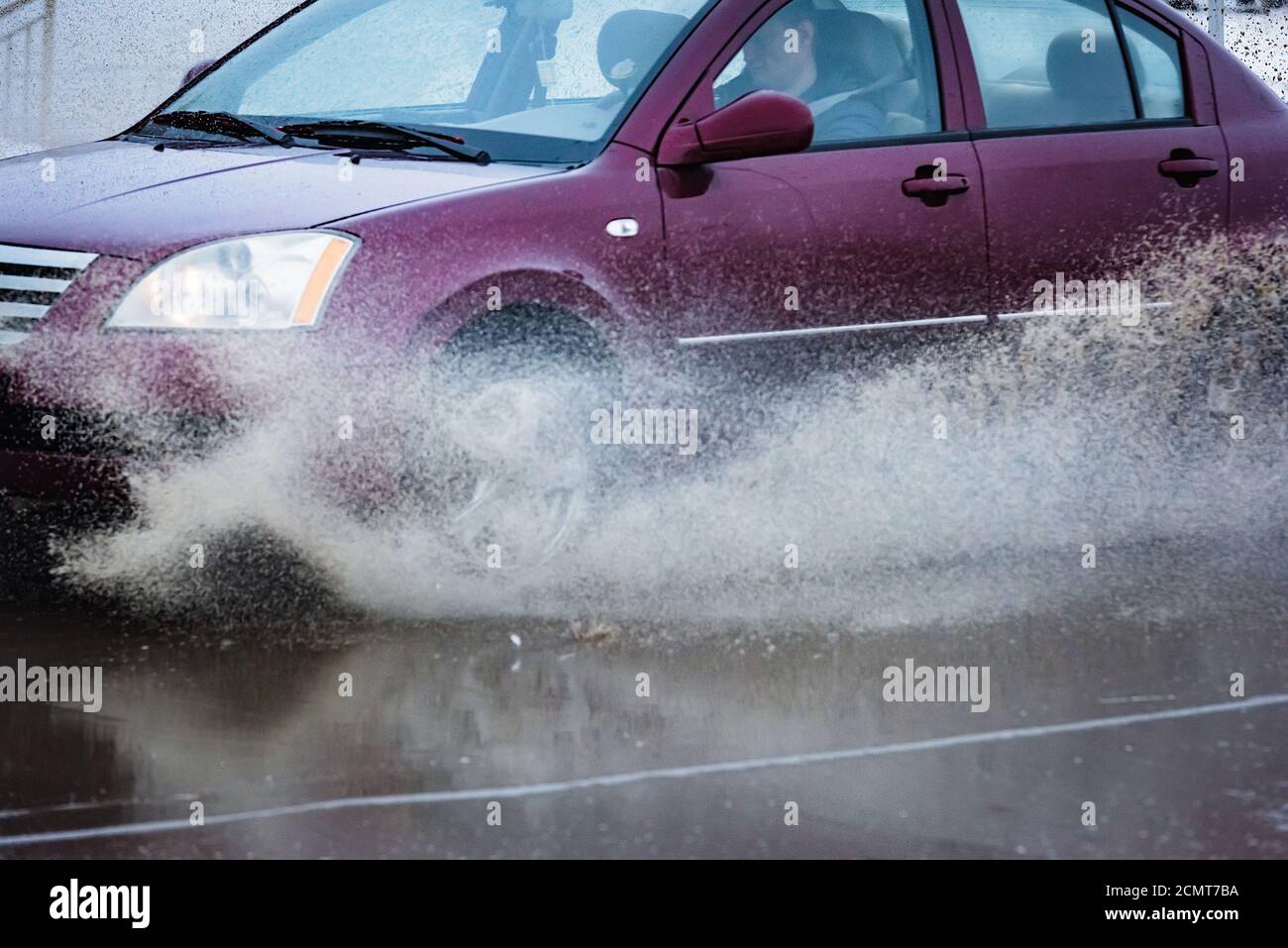 car in a pool of water with splashes Stock Photo - Alamy