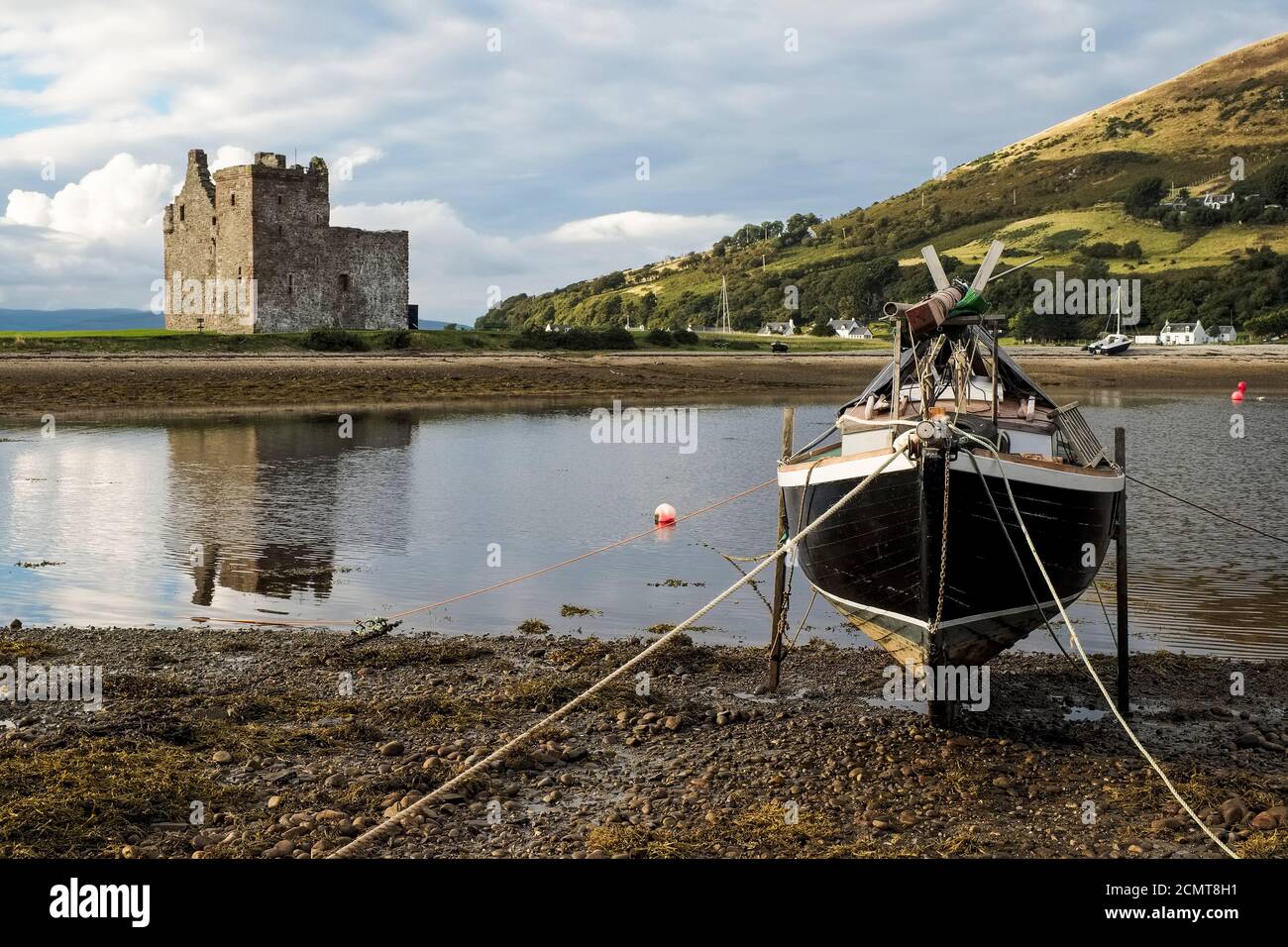 A wooden boat in front of Lochranza Castle Stock Photo - Alamy