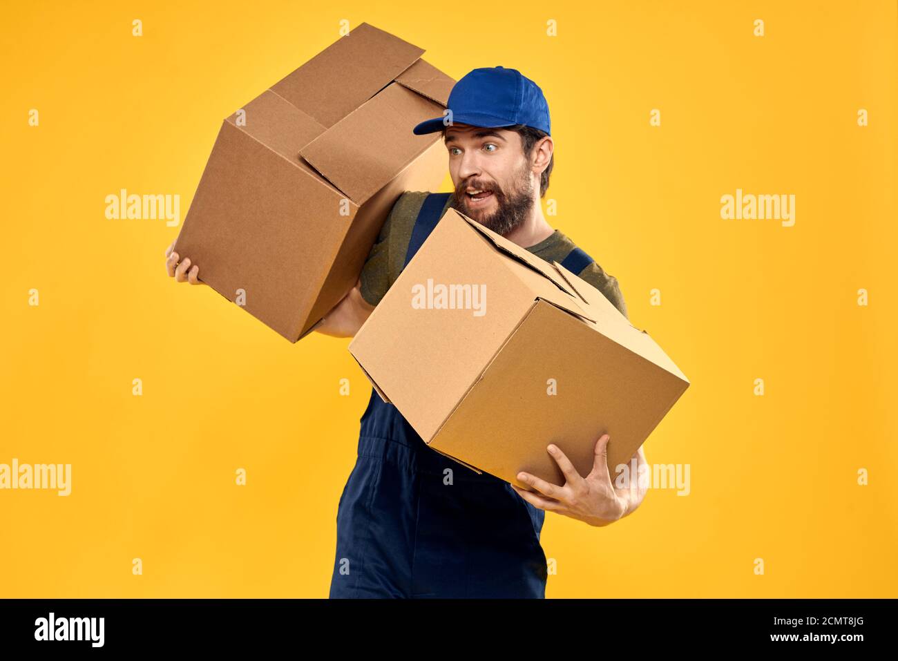 working man with box in hands delivery loading transportation service ...