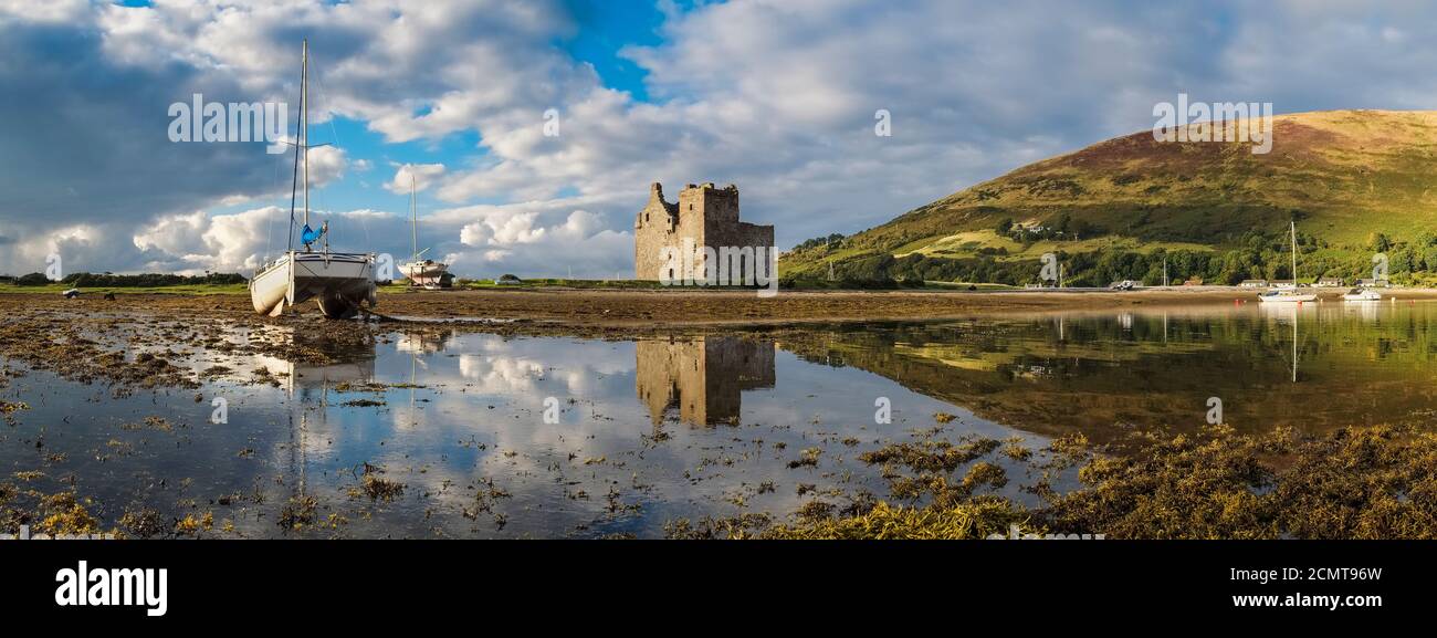 A panoramic image of lochranza castle reflected in the waters of loch ...