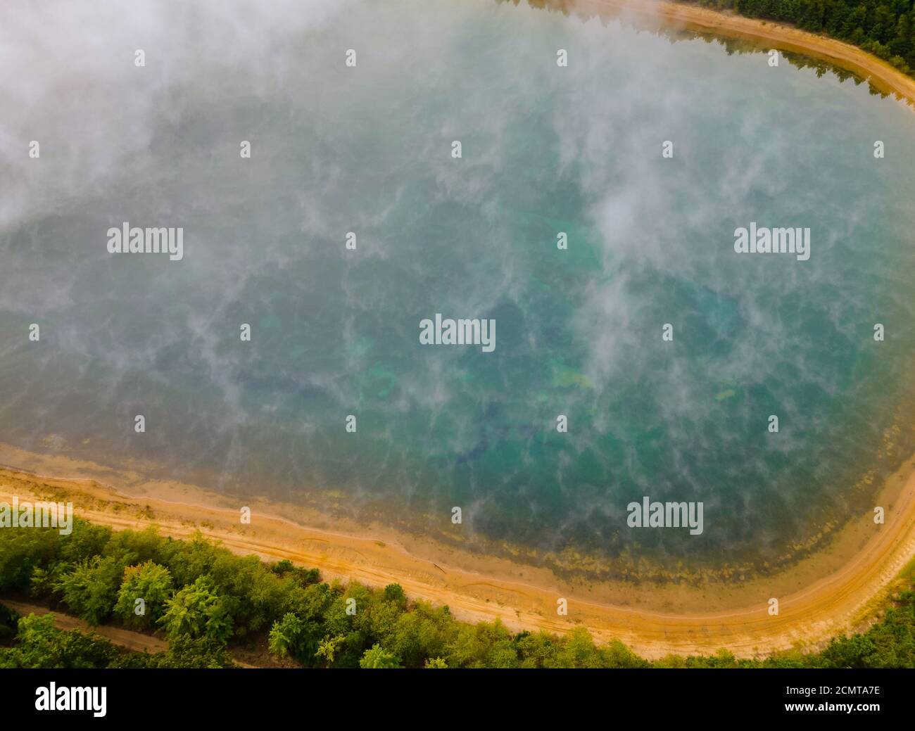 Rising fog forest lake with morning fog above the water Stock Photo - Alamy