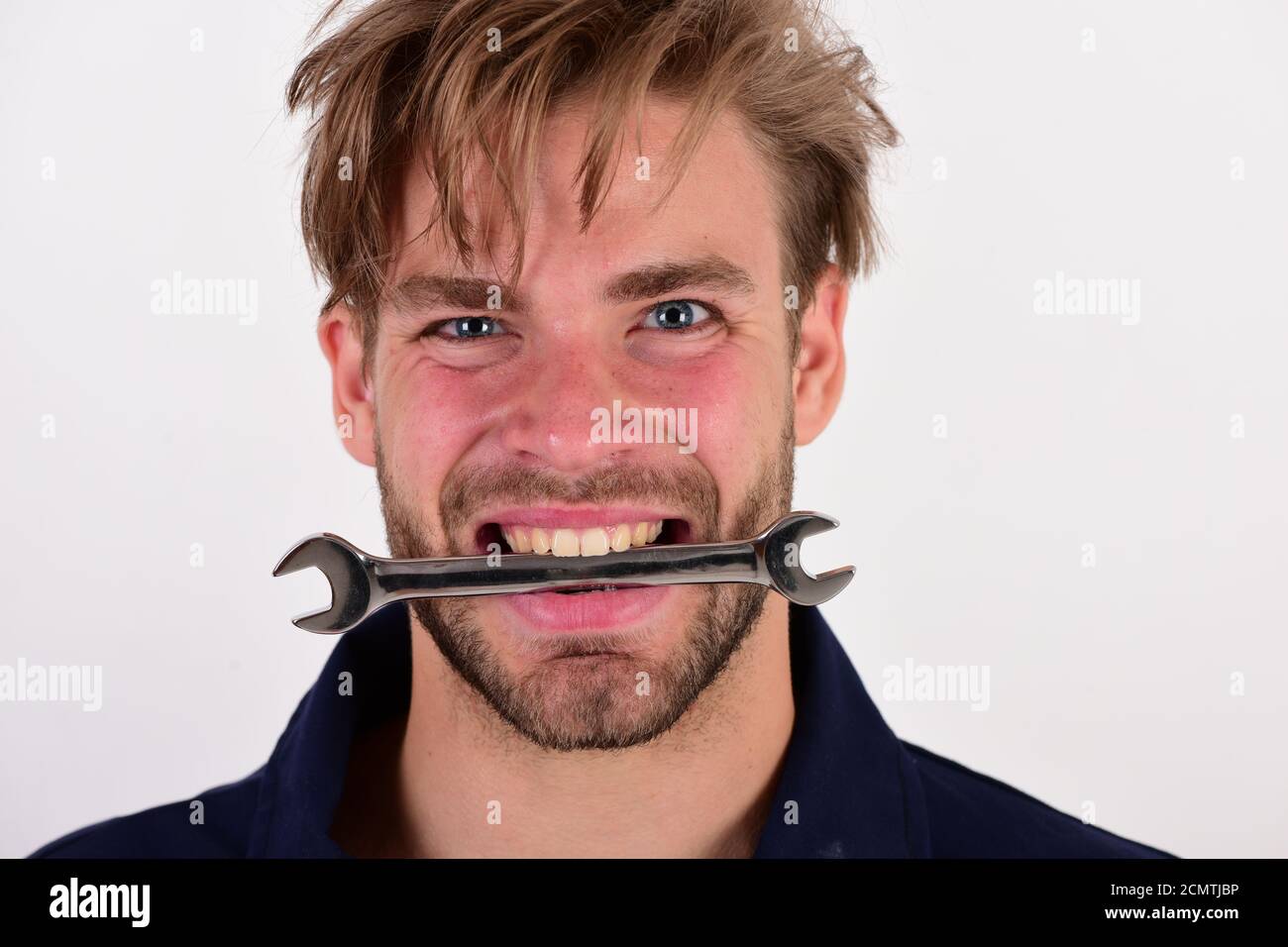 Spanner instrument for fixing or tightening details. Man with funny ...