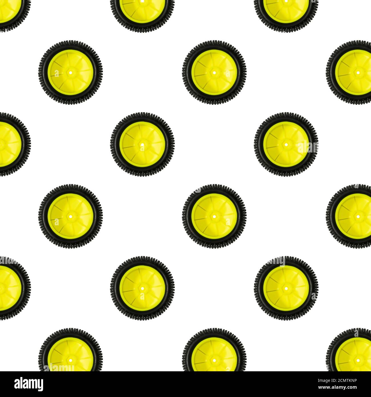 View pattern of mini size yellow plast wheel with black tire isolated ...