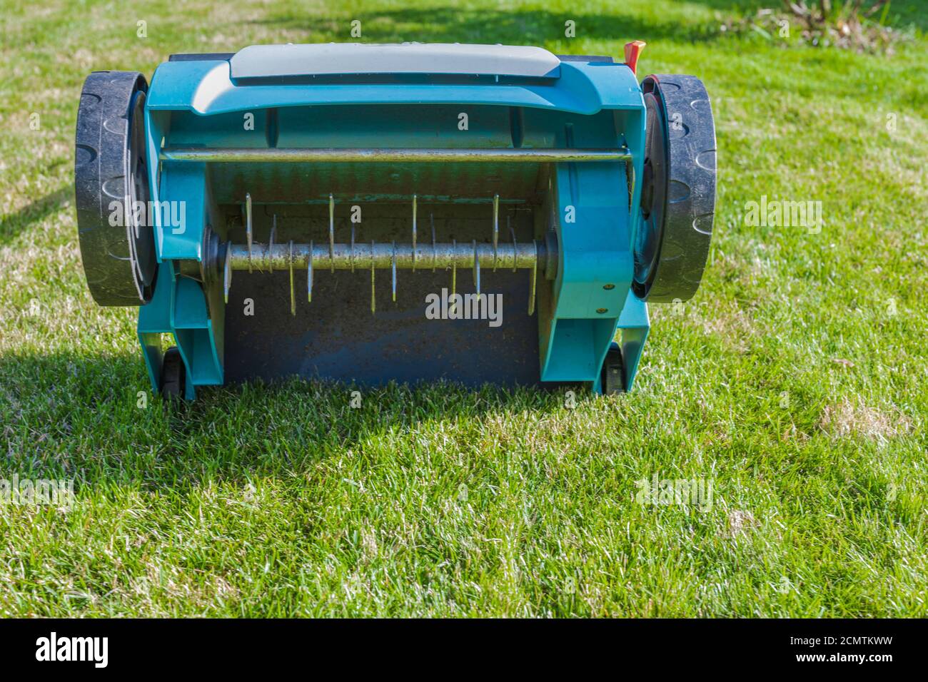Close uo view of electric lawn aerator on green grass isolated. Garden ...