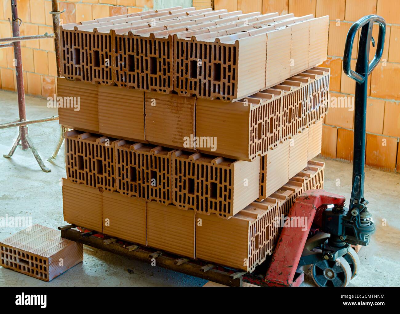 pallet a red brick building material deposited on a construction site ...