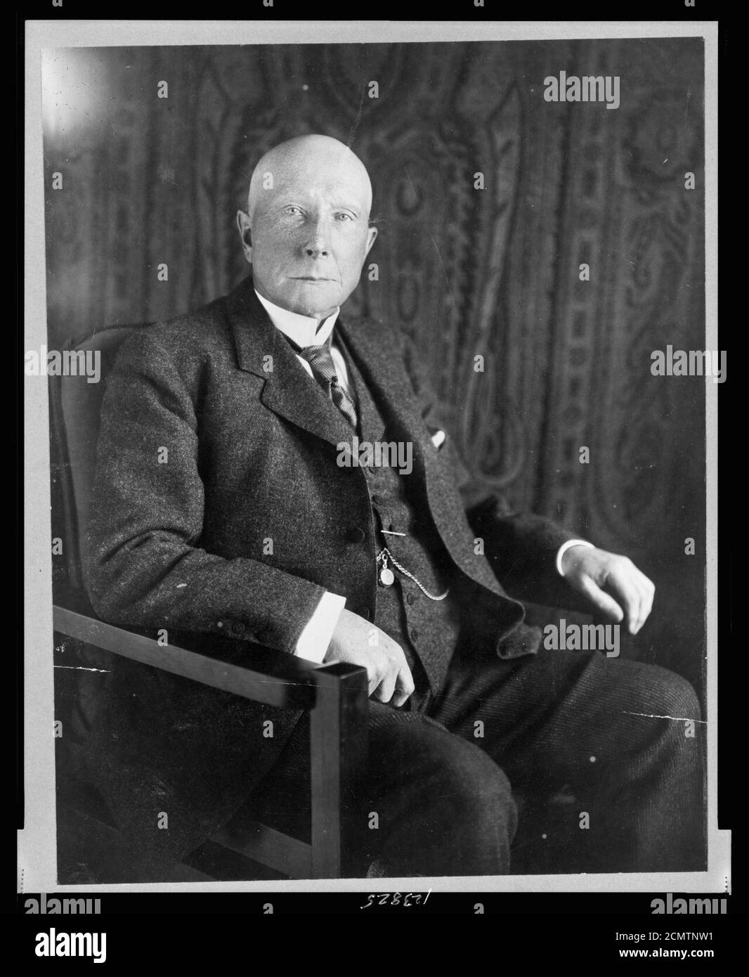 John D. Rockefeller, three-quarter length portrait, seated, facing ...