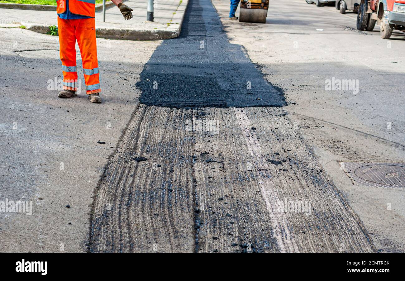 Worker movemen regulates the circulation of vehicles in an intersection ...