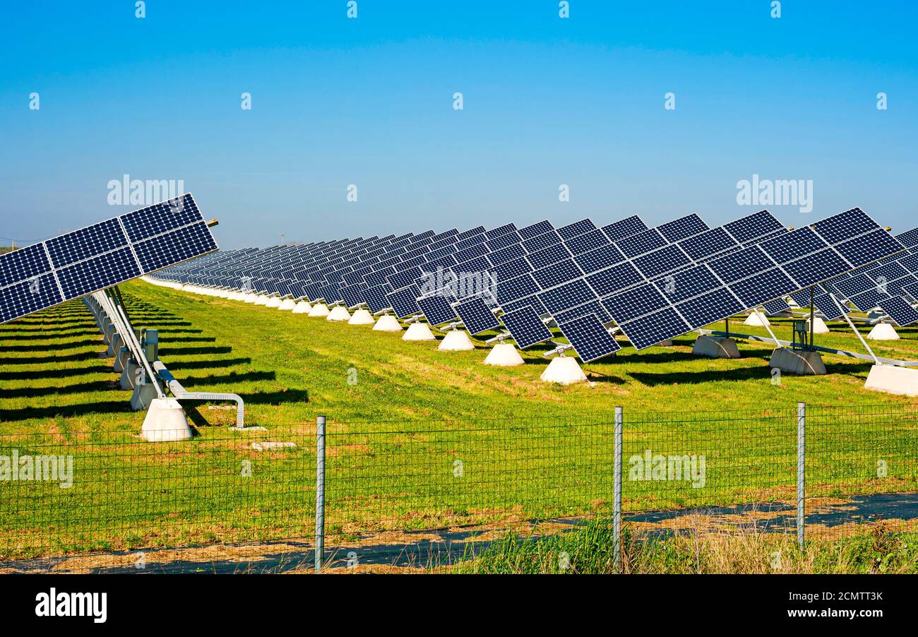 Solar panels placed on a countryside meadow Stock Photo - Alamy
