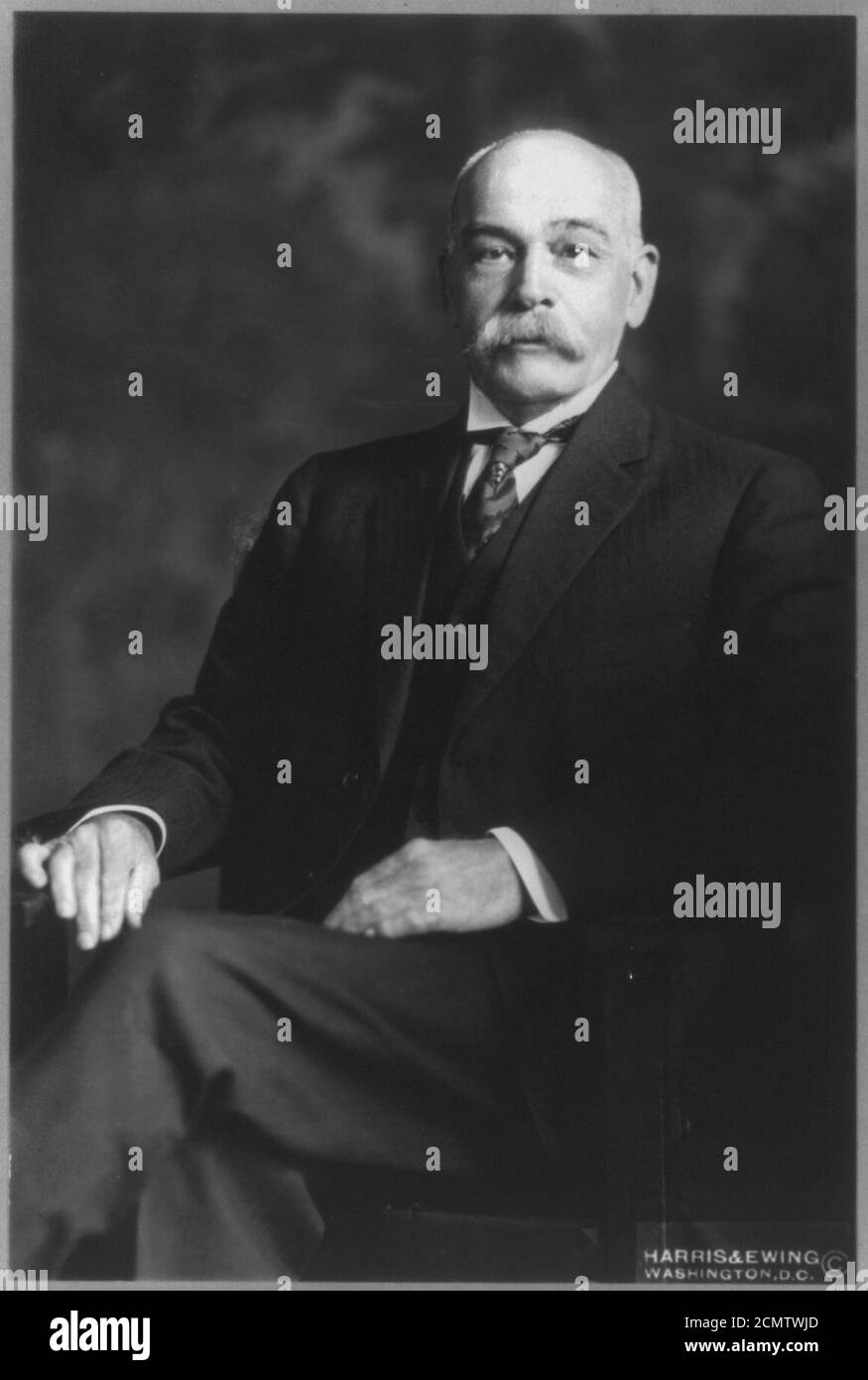 John Ewing, 1857-1920, three-quarter length portrait, seated, facing ...