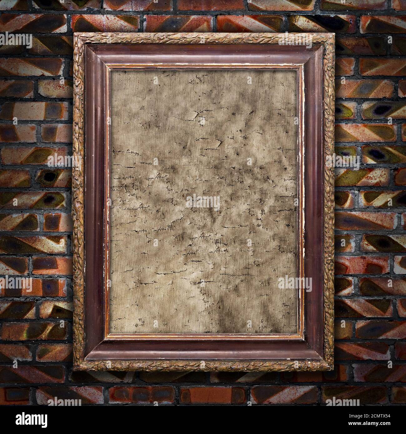 old picture frames with cracked canvas on a brick wall Stock Photo - Alamy