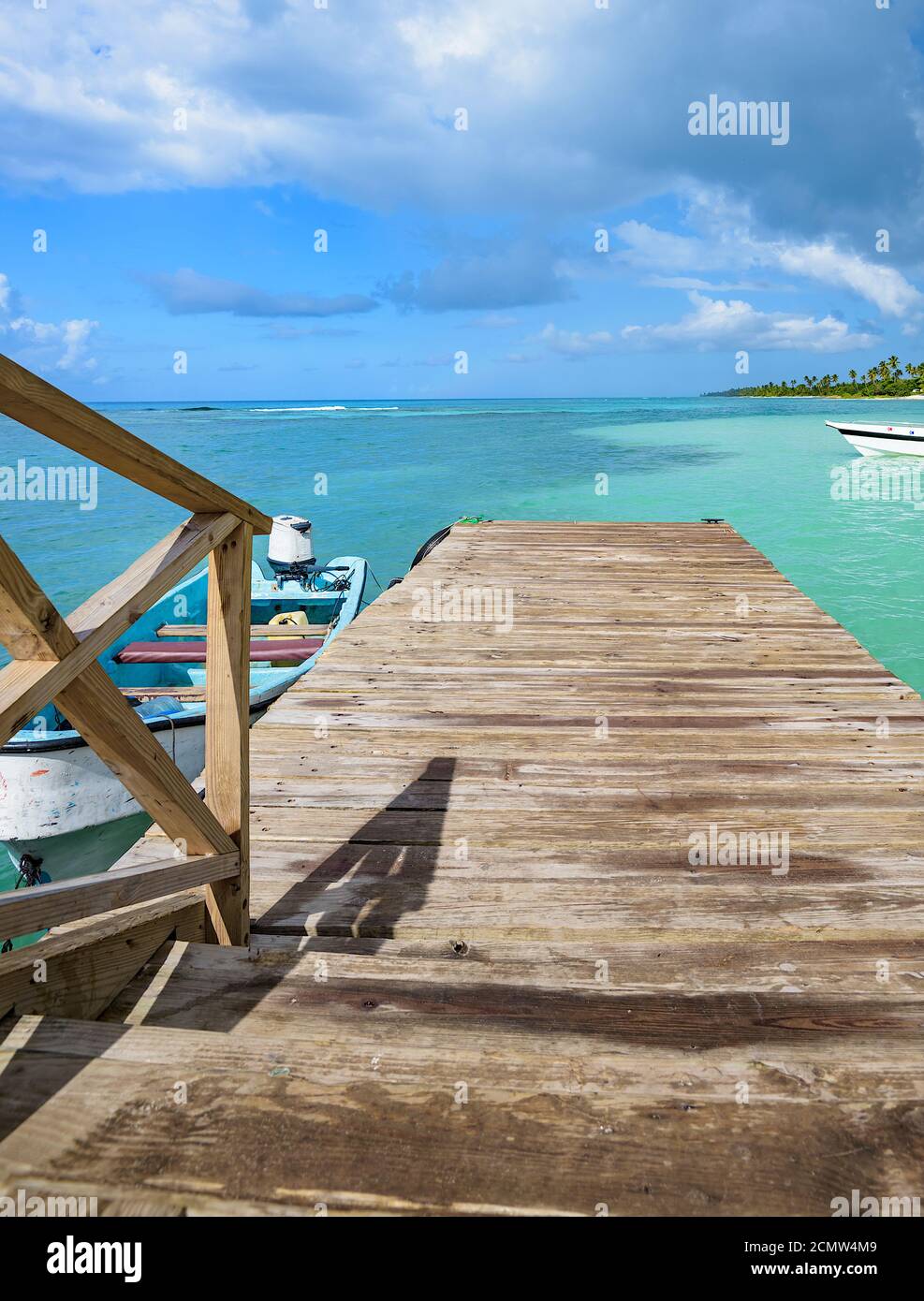 wooden bridge juts out into of the sea Dominican Republic Stock Photo ...
