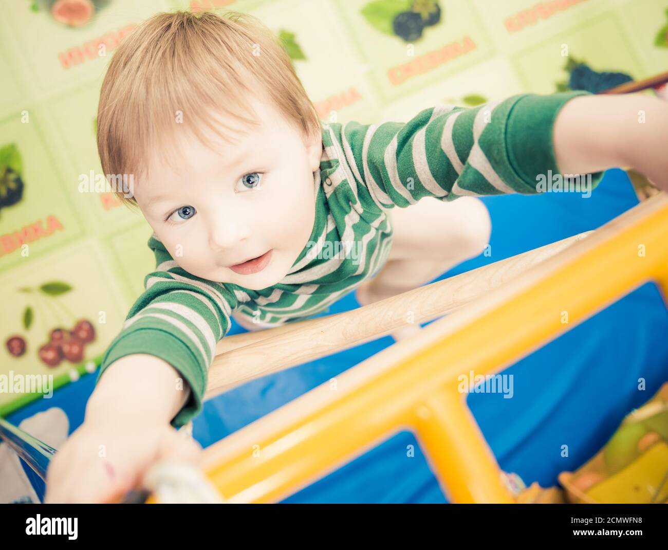 Little boy crawling at metallic home based sport construction Stock ...