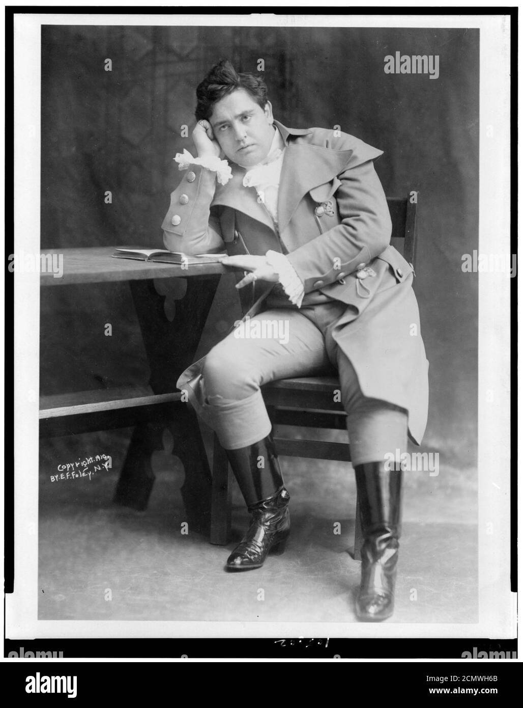 John McCormack, full-length portrait, seated, facing slightly left ...