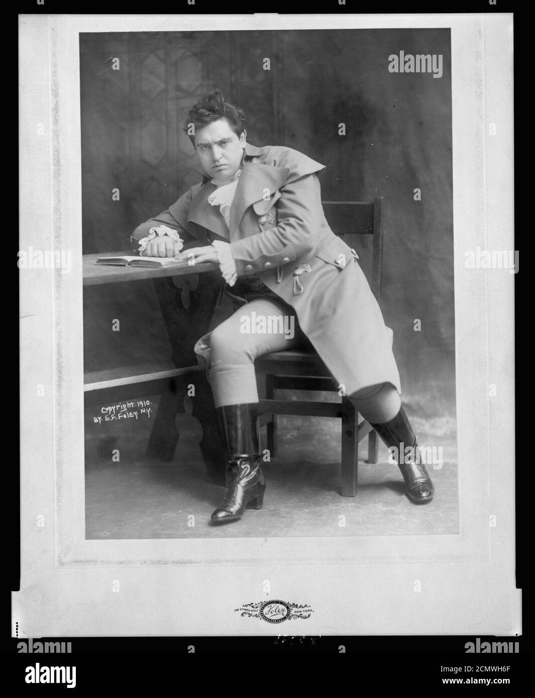 John McCormack, full-length portrait, seated, facing front, dressed in ...