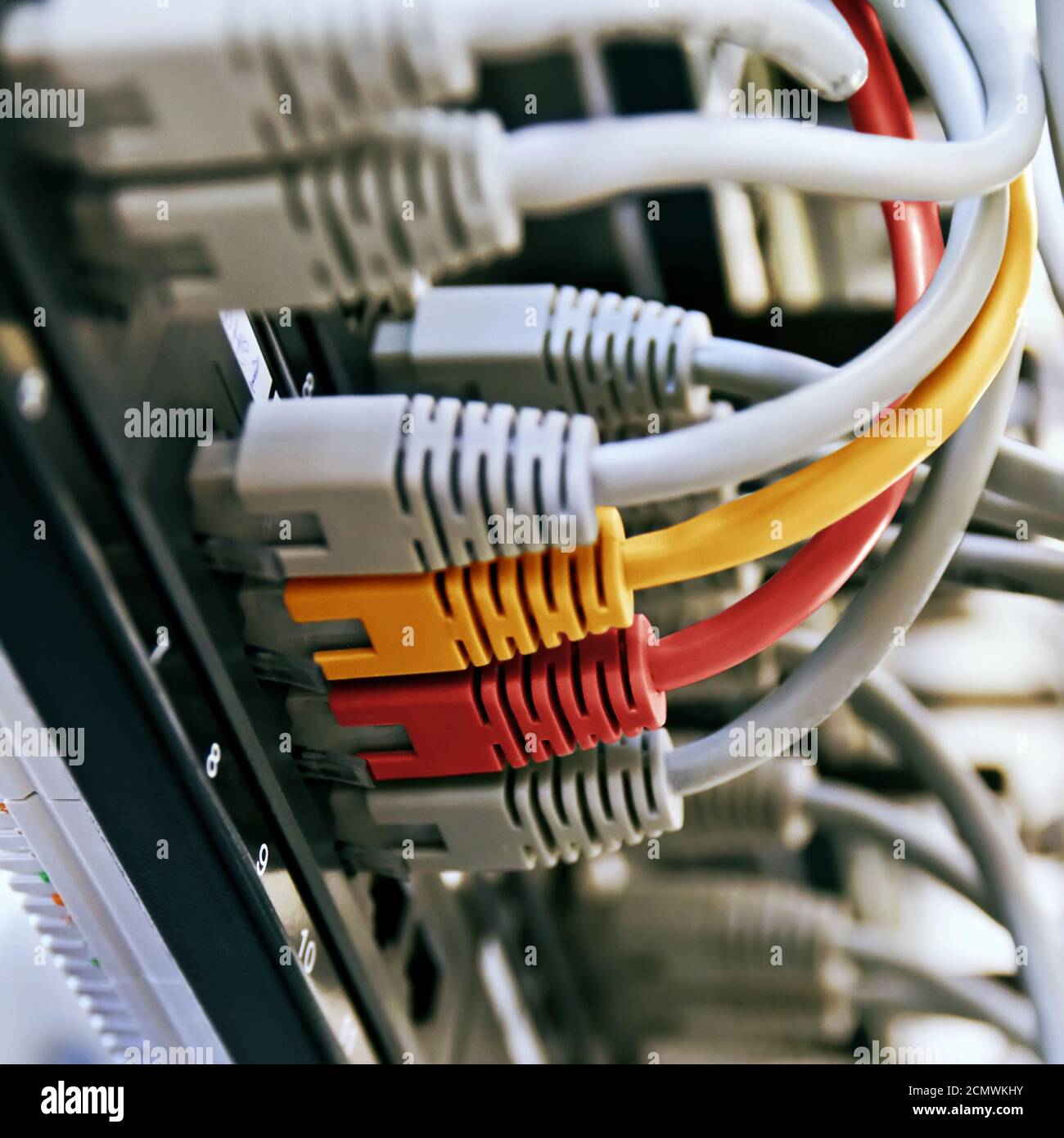 Patch Panel server rack with gray yellow and red cords Stock Photo - Alamy