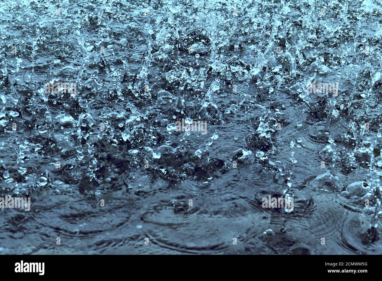 raindrops on water as background Stock Photo - Alamy