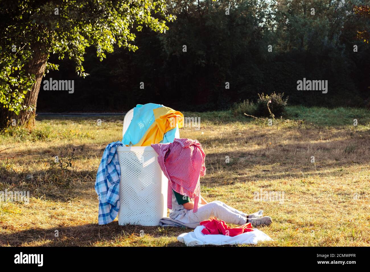 the child is hiding in dirty linen. outdoor Stock Photo - Alamy