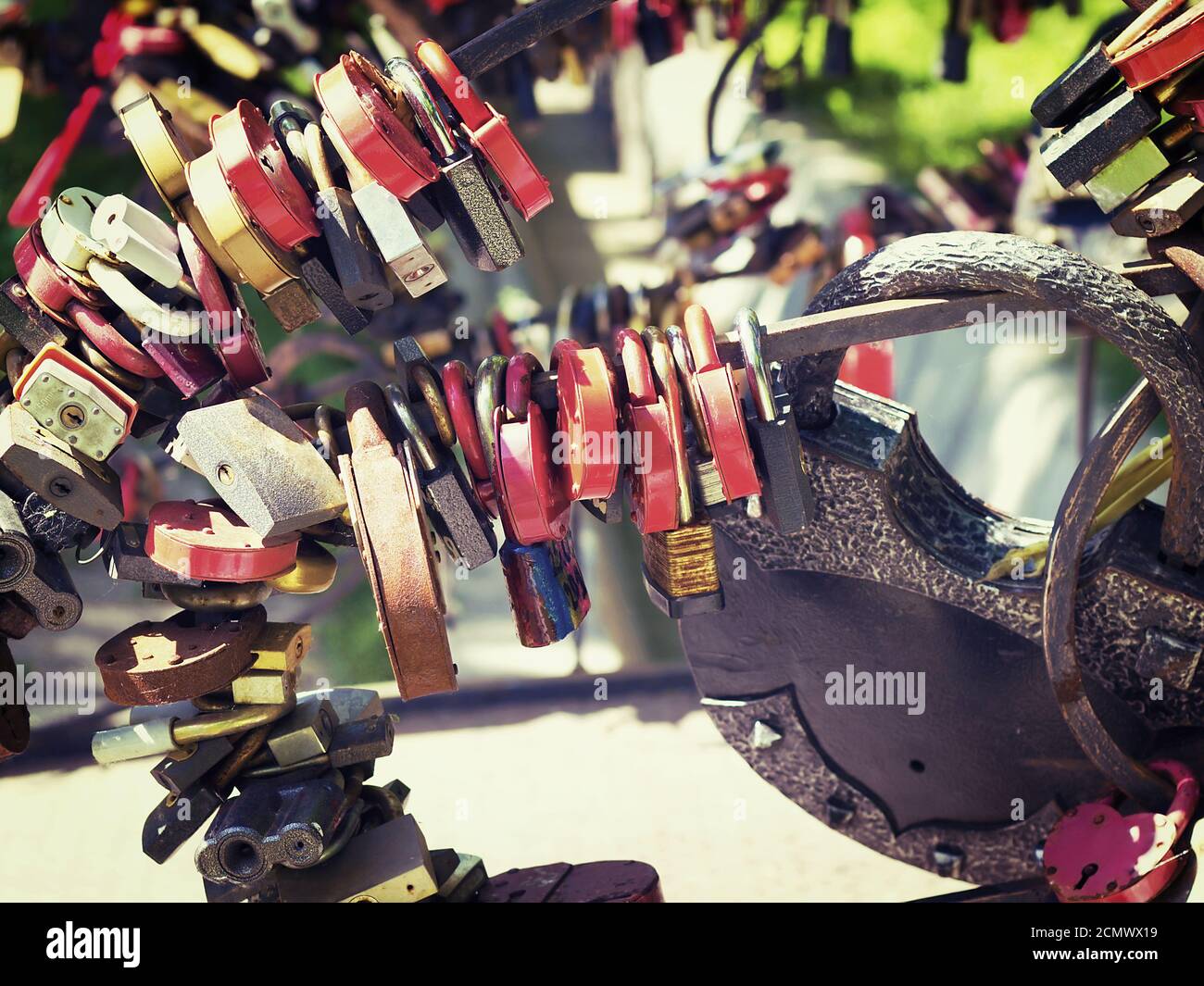 many different colored padlocks hung in a row Stock Photo - Alamy