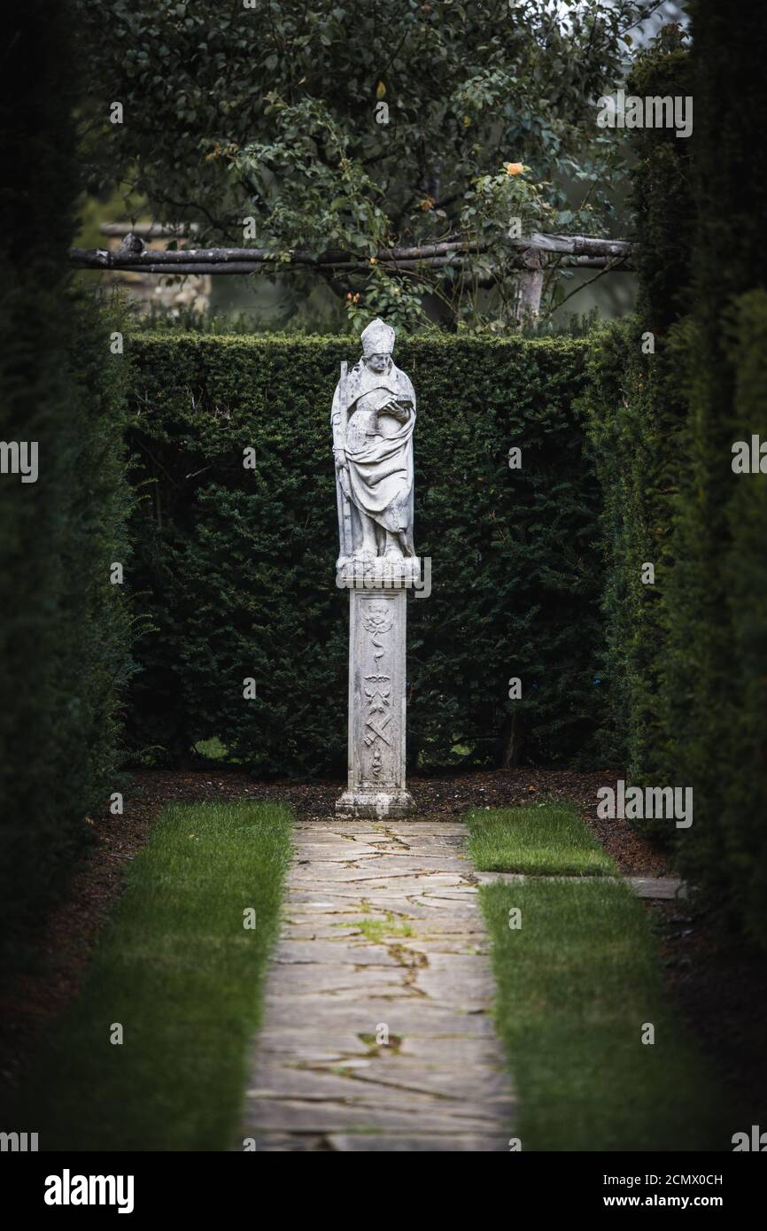 Beautiful stonework statue of a priest in the castle of Hever Castle in ...