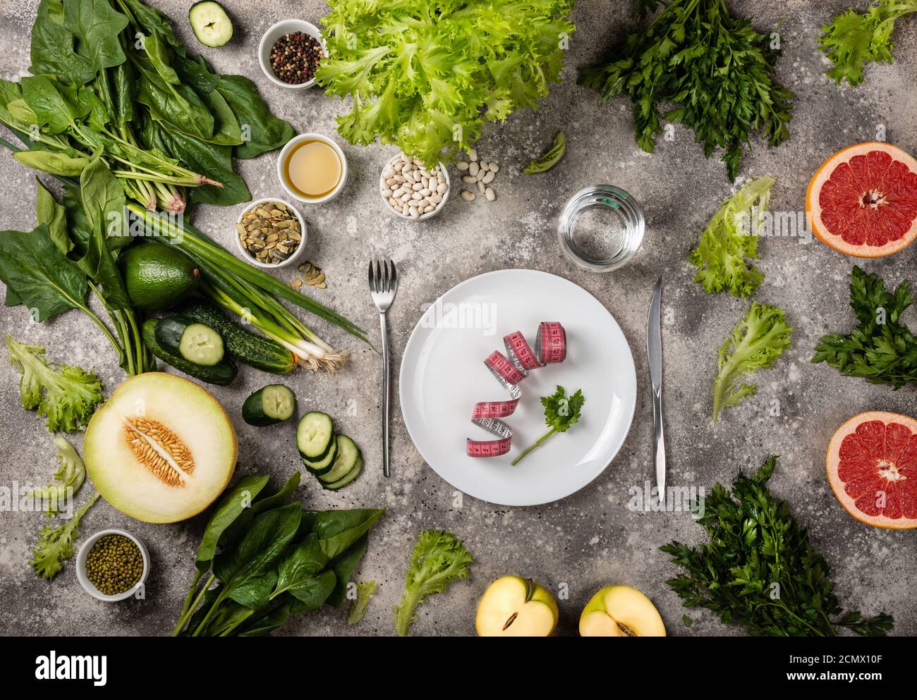 Weight loss concept. Measuring tape on the plate and healthy food set ...