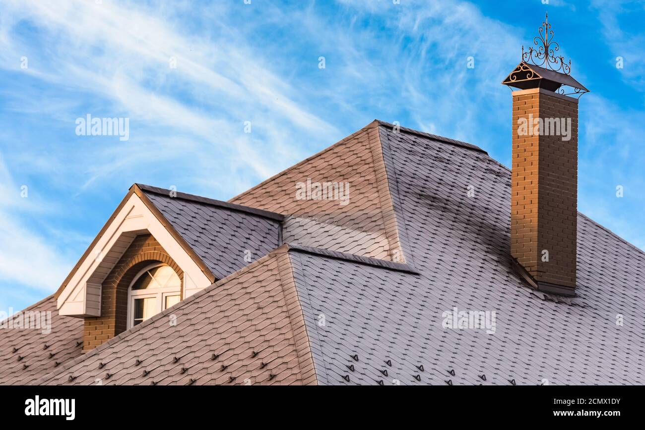 house with a gable roof window Stock Photo - Alamy