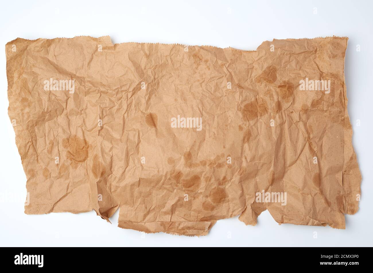 torn crumpled piece of brown paper with grease stains Stock Photo - Alamy
