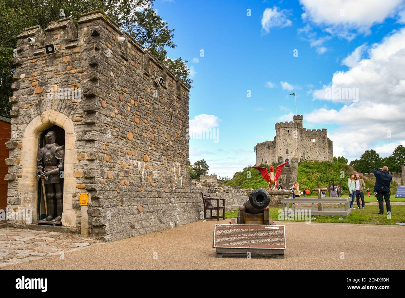Cardiff, Wales - August 2020: Old cannon and knight in armour in the ...