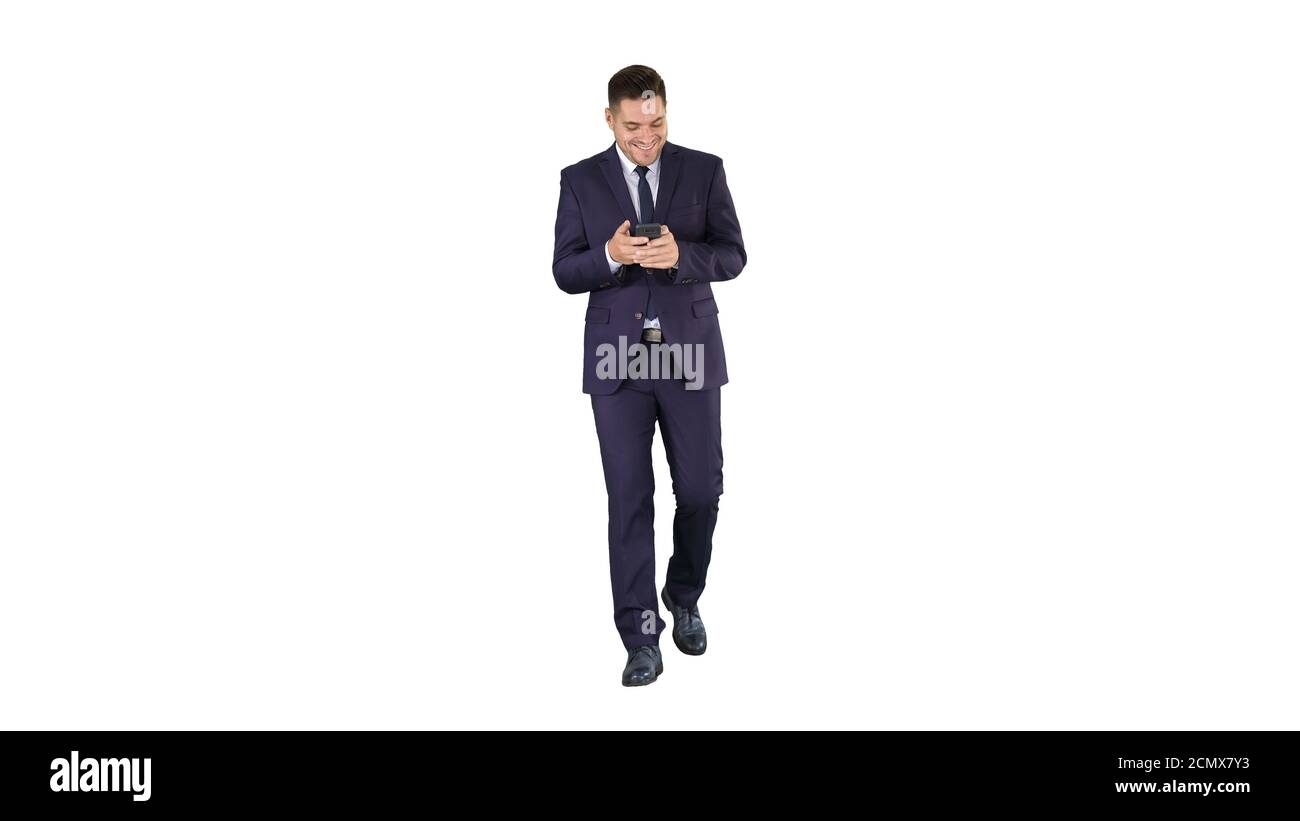 Businessman walking on street typing hi-res stock photography and ...