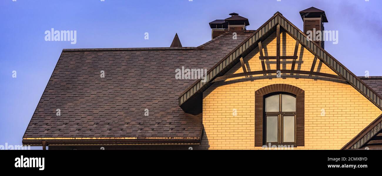 house with a gable roof window Stock Photo - Alamy