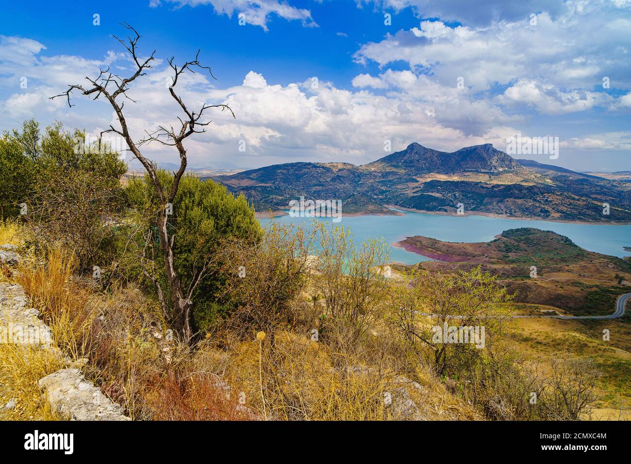 landscape of turquoise lake with mountains and hills in andalusia with ...