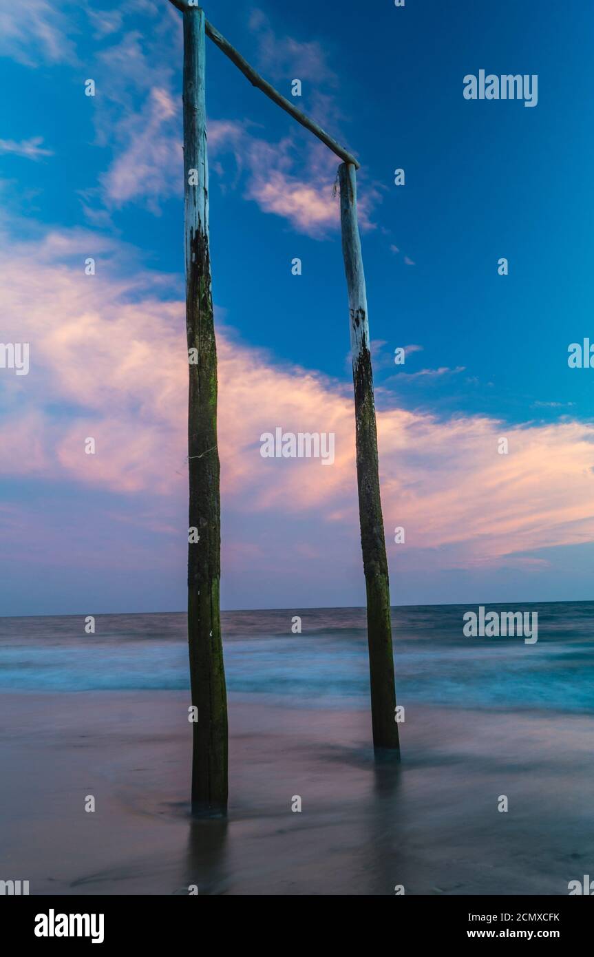 Wooden poles on the beach hi-res stock photography and images - Alamy