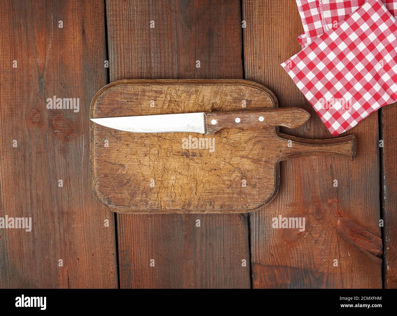 very old empty wooden rectangular cutting board and knife, top view ...