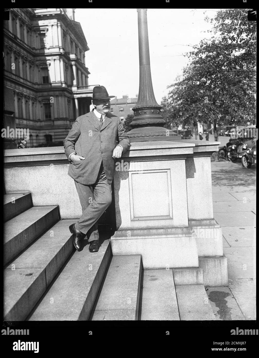 John W. Weeks on steps of State, War, and Navy Building, Washington, D ...