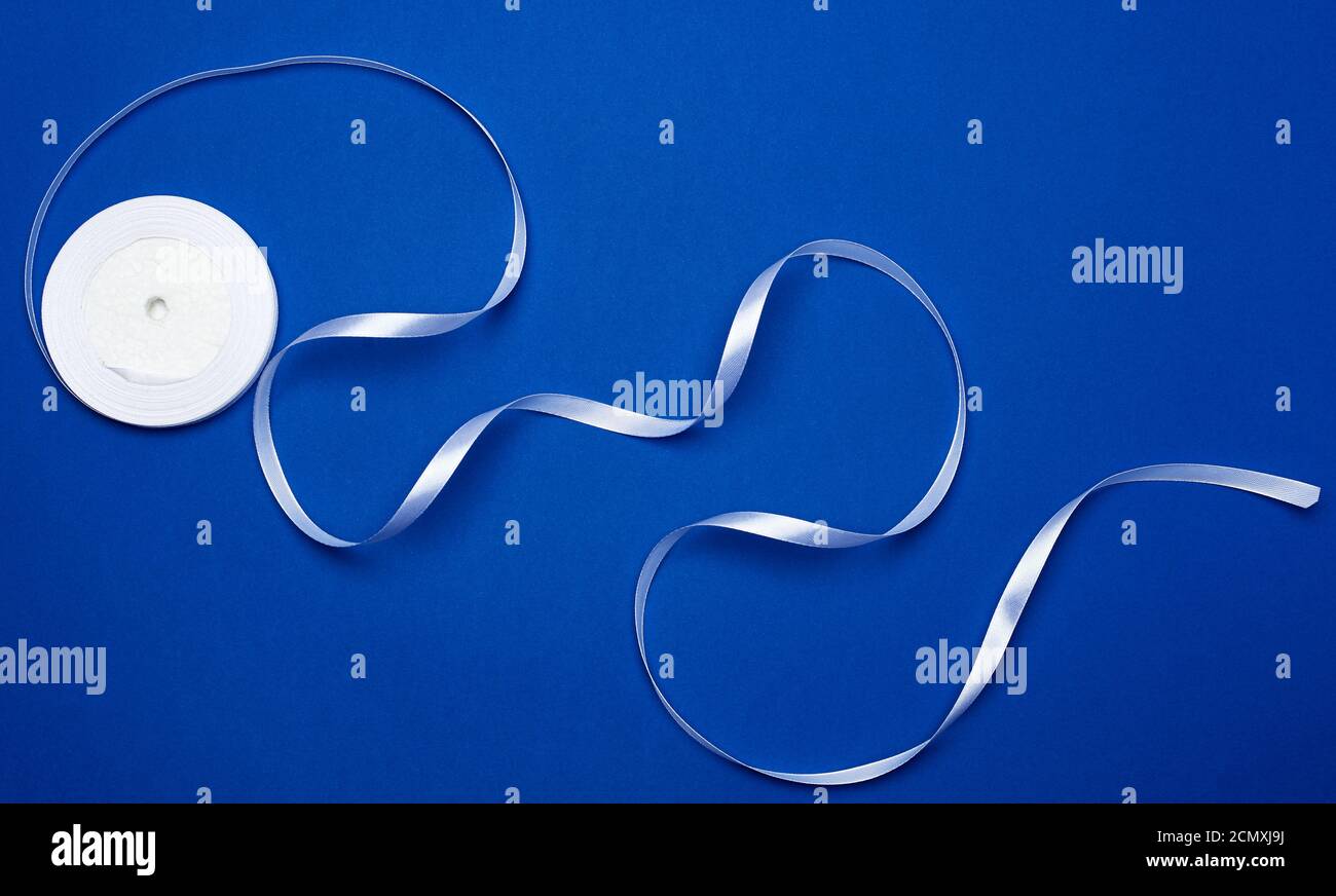 Thin white ribbon hi-res stock photography and images - Alamy