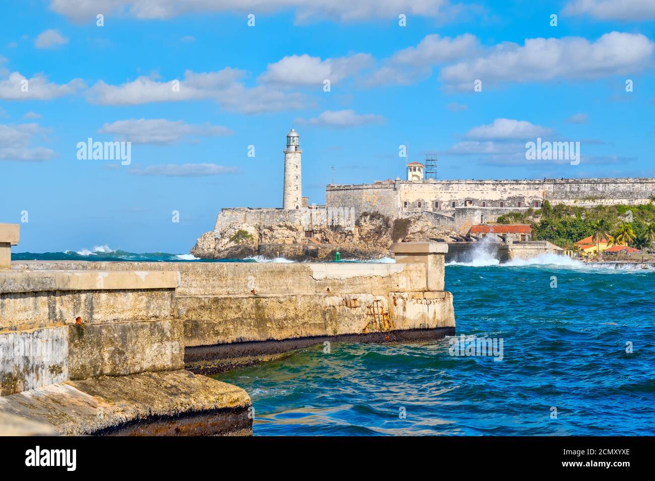 The fortress and lighthouse of El Morro and the Malecon seawall ...