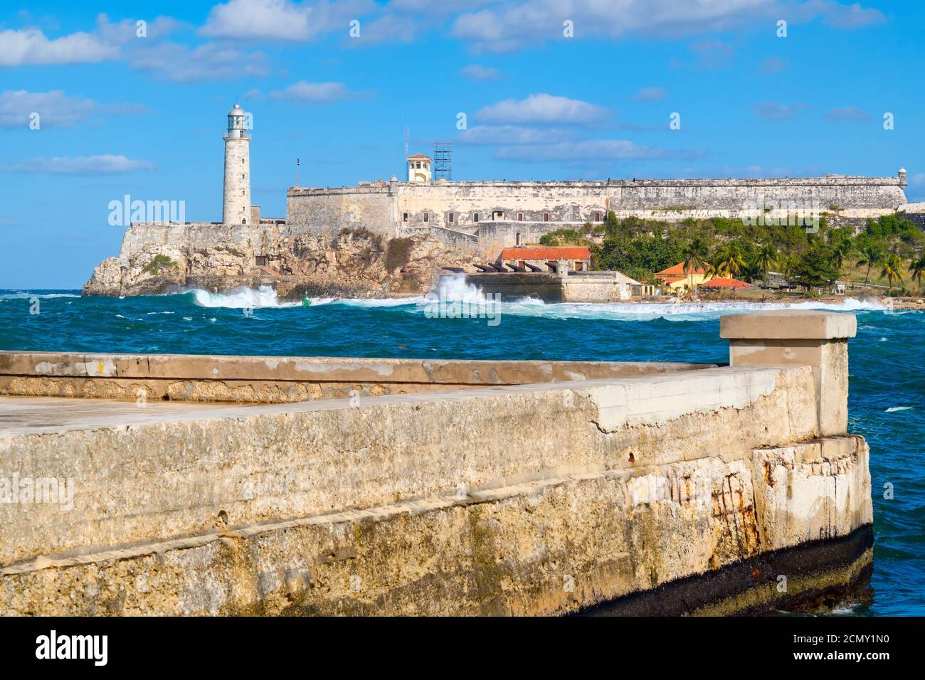 The fortress and lighthouse of El Morro and the Malecon seawall ...