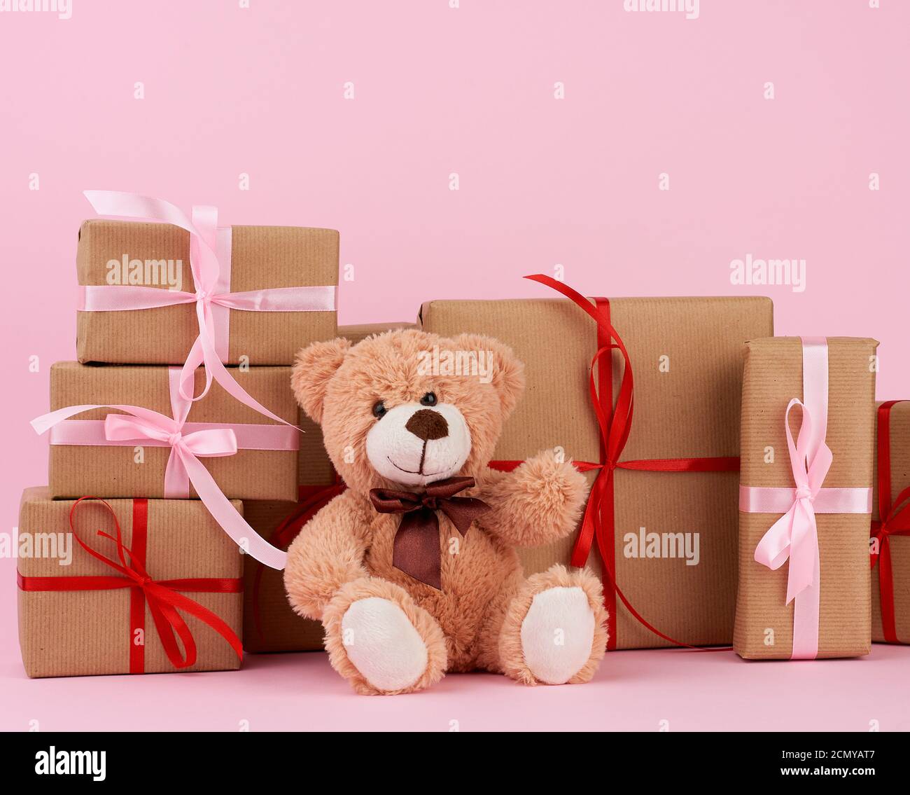 brown cute teddy bear and gifts wrapped in brown eco kraft paper and ...
