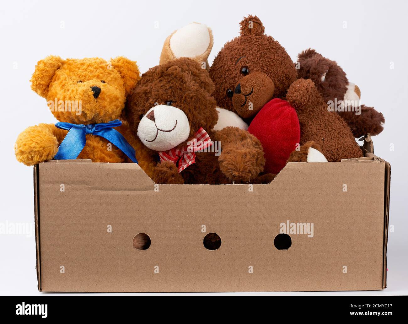 brown cardboard box with various teddy bears, white background Stock ...