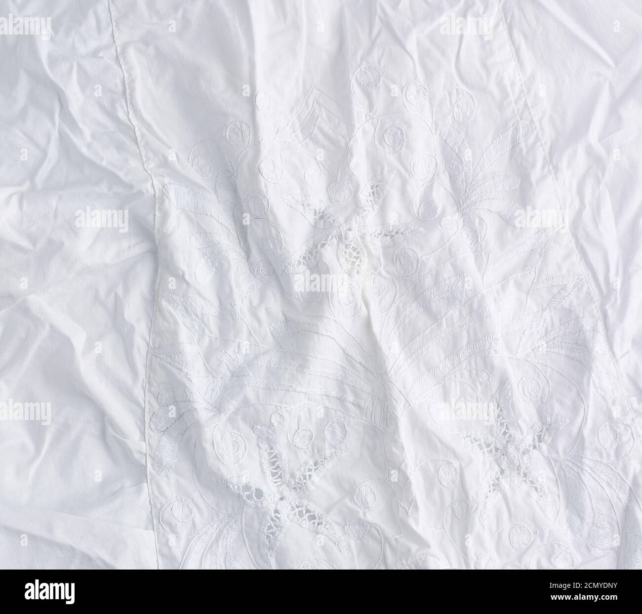 crumpled white cotton fabric, with embroidery elements Stock Photo - Alamy