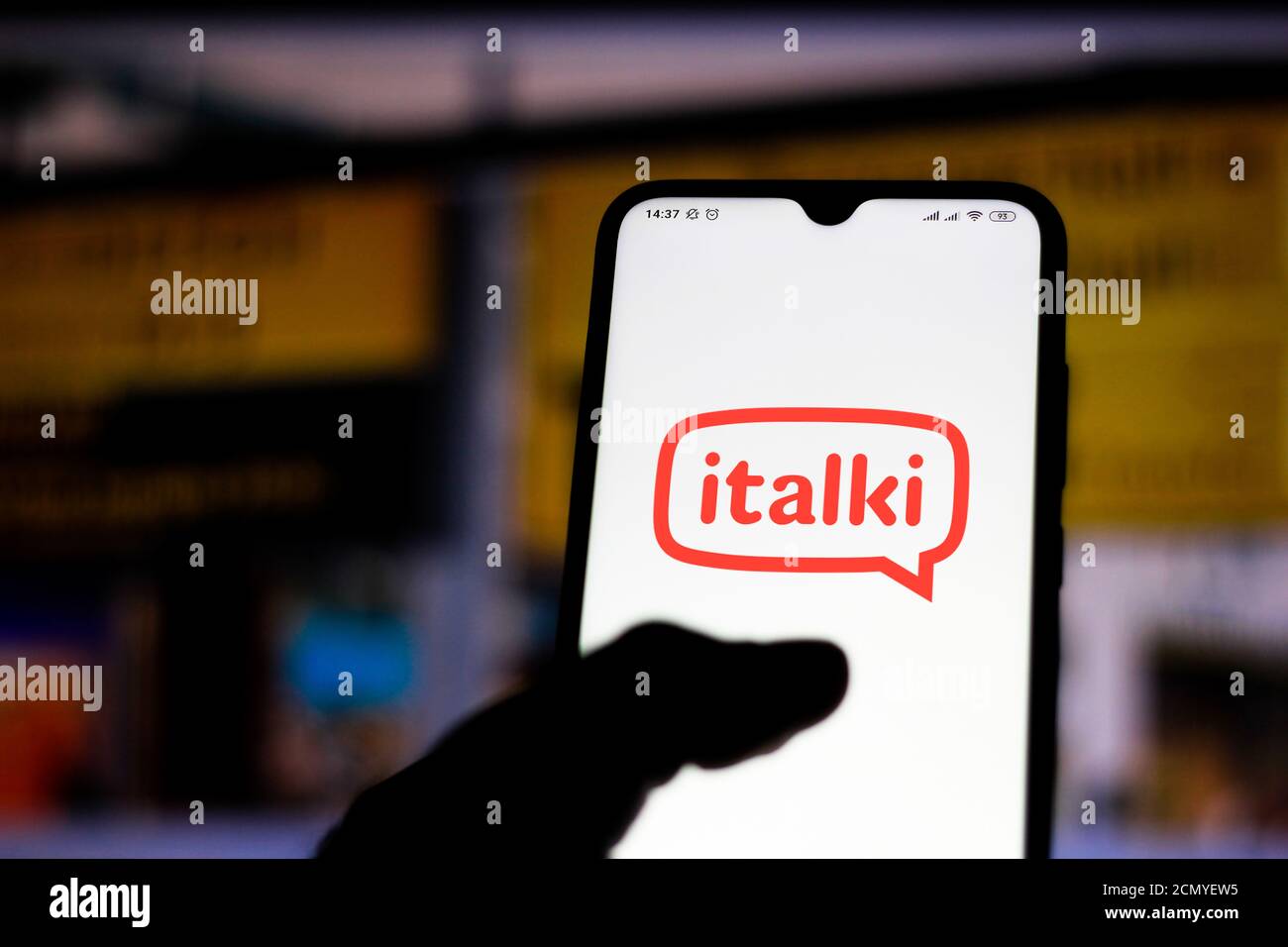 In this photo illustration the italki logo seen displayed on a ...