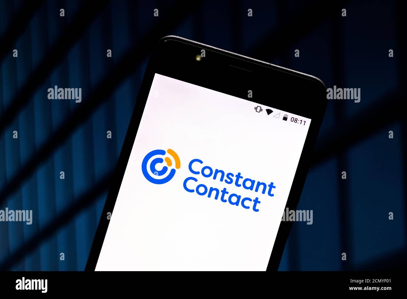 In this photo illustration of the Constant Contact logo seen displayed ...