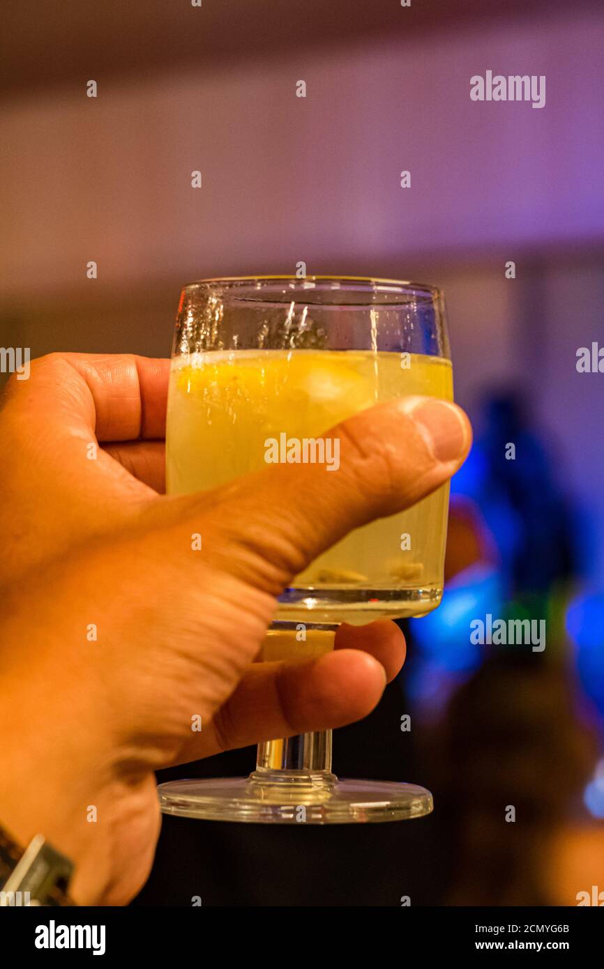 Holding drink, cheers celebrating party in Cabo Verde Stock Photo - Alamy