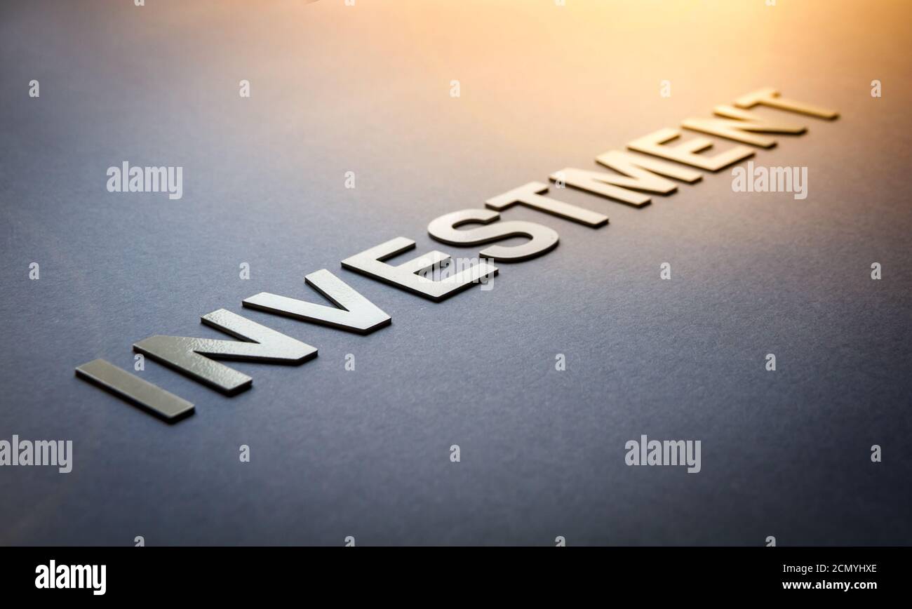 Word investment written with white solid letters Stock Photo - Alamy