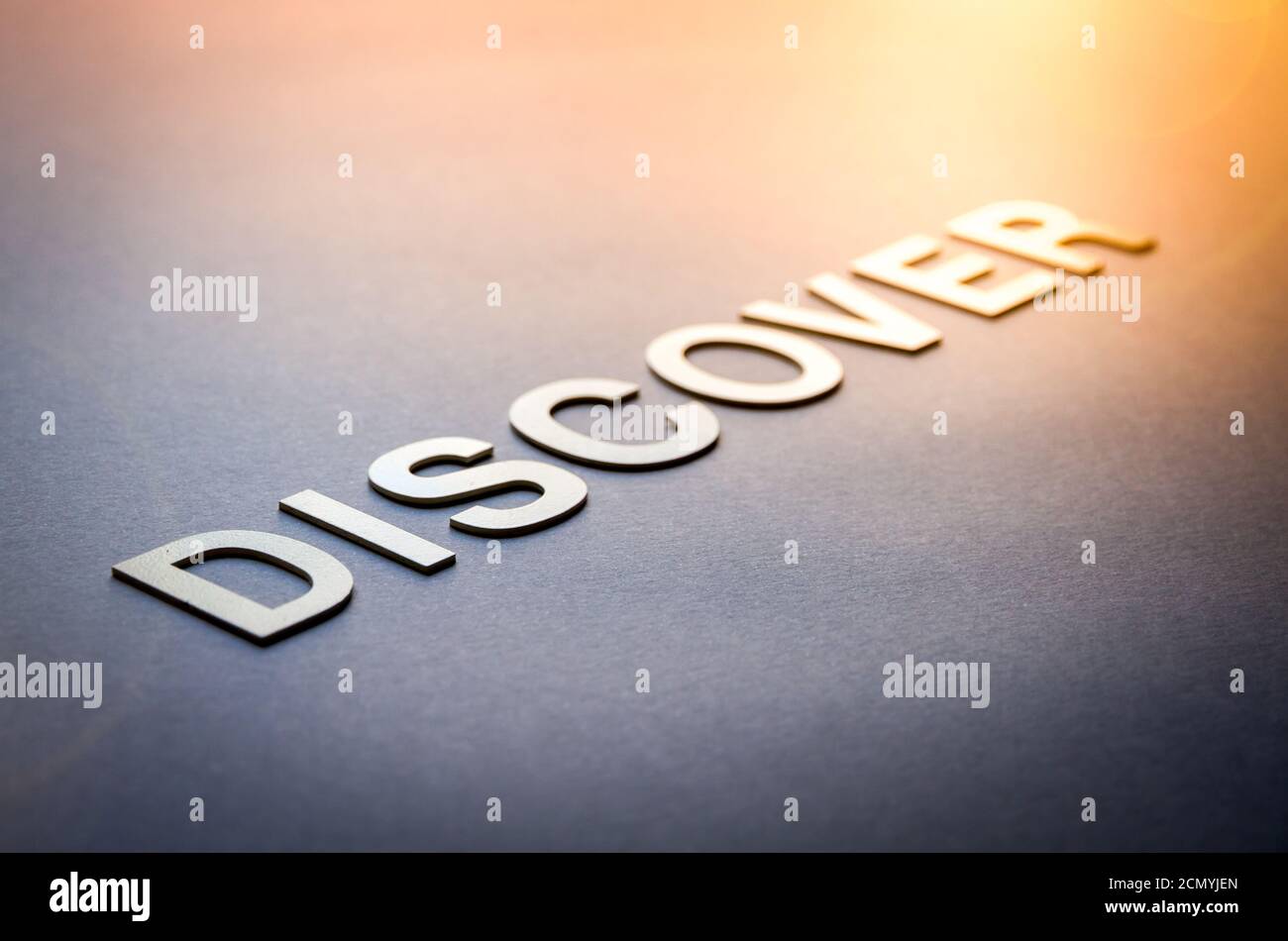 Word discover written with white solid letters Stock Photo - Alamy